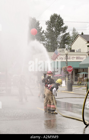 Firemen competing in Firefighters Waterball event during Kla Ha Ya ...