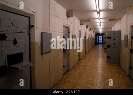 Corridor lined by prison cells, former East German prison Stock Photo ...