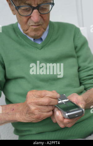 old man with mobile phone / PDA Stock Photo - Alamy
