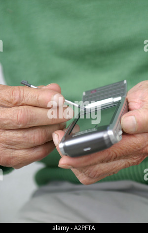old man with mobile phone / PDA Stock Photo - Alamy