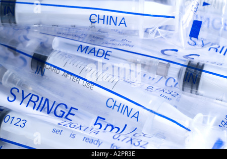 Disposable hypodermic syringes in packaging Stock Photo - Alamy
