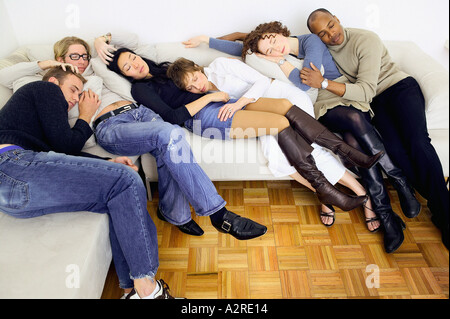 Asian man sleeping on sofa at home for illness recovery Stock Photo - Alamy