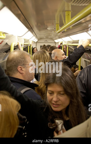 Christmas shoppers on crowded Underground tube train Stock Photo - Alamy
