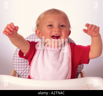 Toddler Sitting in a High Chair in a Modern Kitchen at Home Stock Photo ...