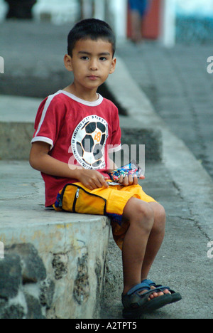 Young ecuadorian boy playaing cards in Santa Cruz, Ecuador Stock Photo ...