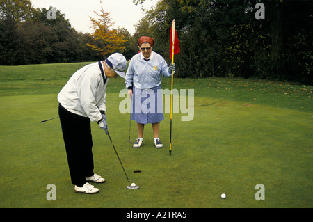 women golfers playing a round Stock Photo - Alamy