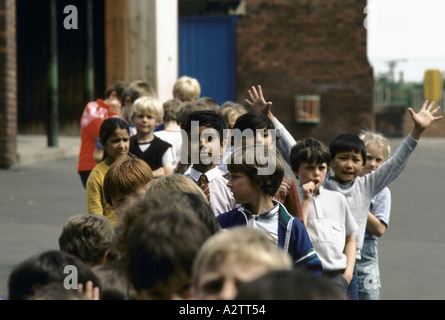 children lining up in playground Stock Photo - Alamy