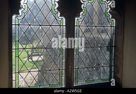 15th century Perpendicular Gothic diamond leaded window in warm early ...