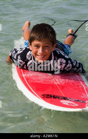 Boy on a surfboard, Waikiki, Oahu, Hawaii Stock Photo - Alamy