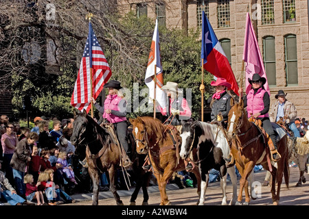 Cowgirls riding horses with US flags at a rodeo parade Stock Photo ...