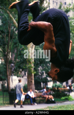 One young muscled man, flexible ballet dancer in action with red fabric ...