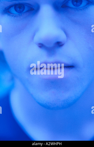 Close up side portrait of handsome man working at outdoor cafe on ...