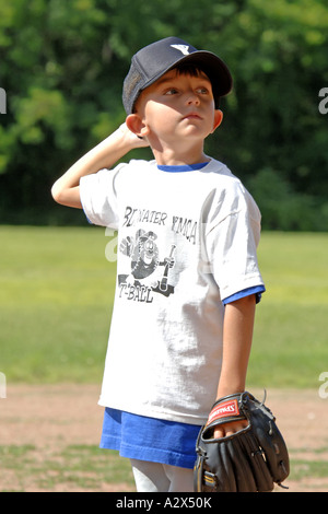 Pre-K Children taking part in a T Ball game at a summer childrens ...