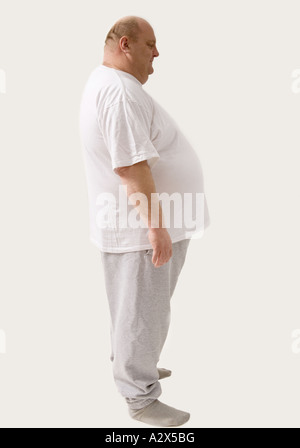 Fat Man Standing in Profile and Holding her Belly Stock Photo - Alamy