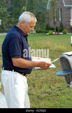 US mail box collecting mail from the mailbox Stock Photo - Alamy