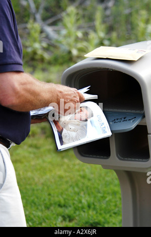 US mail box collecting mail from the mailbox Stock Photo - Alamy