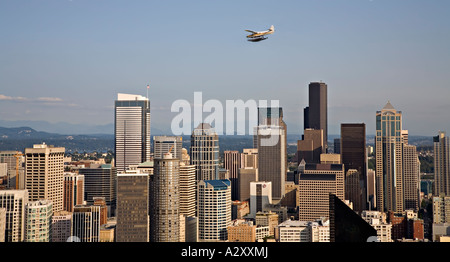 aeroplane flying over the skyscrapers. architecture building with ...