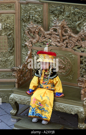 LITTLE EMPEROR. A young Chinese boy enjoys his time in photographers ...