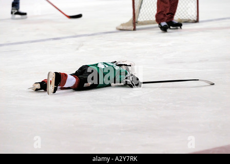 A boy is learning to play ice hockey on the Beishanxi Lake in Jilin ...