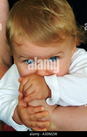 Baby girl chewing her feet Stock Photo - Alamy