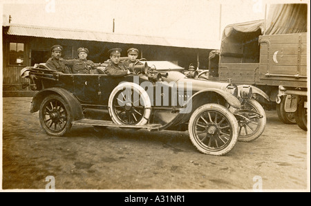 Four British soldiers in a staff car at an army base Date: 1914 - 1918 ...