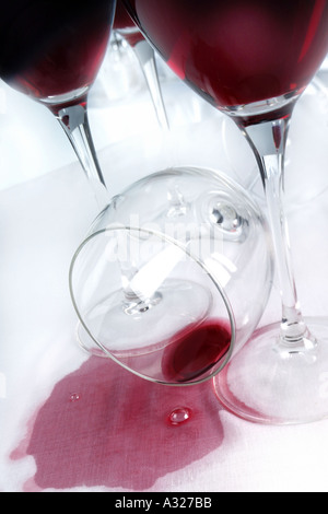 Spilt glass of red wine on a white background Stock Photo - Alamy
