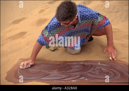 NAMIBIA Tourists sand surfing Stock Photo - Alamy
