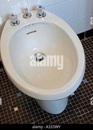 old fashioned bidet in a bathroom Stock Photo - Alamy