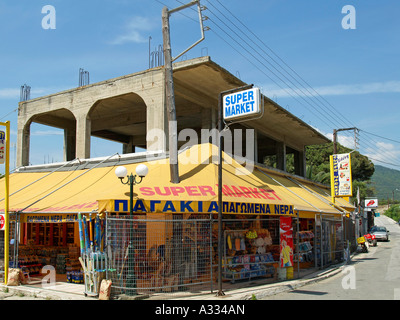 typical facade storefront of a supermarket shop in a cocrete house in ...
