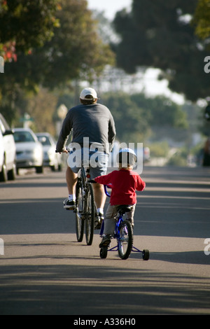 child or youngster on a bike learning to ride child or youngster on a ...