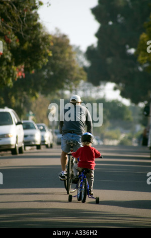 child or youngster on a bike learning to ride child or youngster on a ...