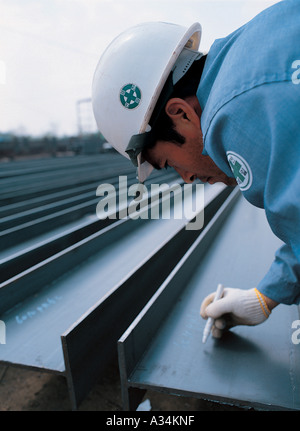 construction worker writing Stock Photo - Alamy