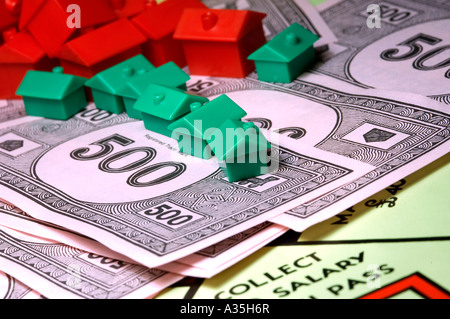 Monopoly board game with money, notes, counters and dice in studio ...