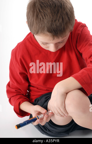 Young diabetic boy injecting himself with insulin Stock Photo - Alamy
