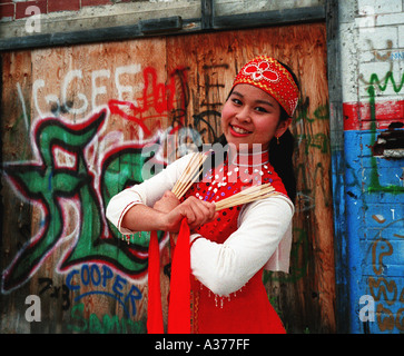 chinese chop stick dance by Chinese girl in red costume and scarf Stock ...
