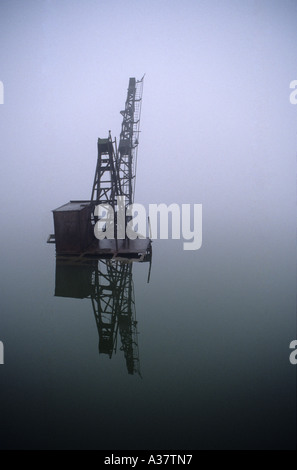 Derelict crane in old gravel quarry workings at Cliffe Kent Stock Photo ...