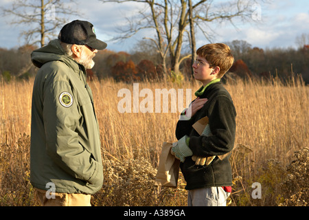 PRESERVES Vernon Hills Illinois Teenage boy talk to adult male ranger ...