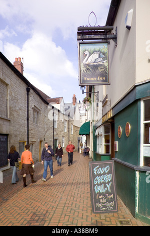 UK, Gloucestershire, Stroud, Swan Lane, Swan Inn’s sign over the road ...