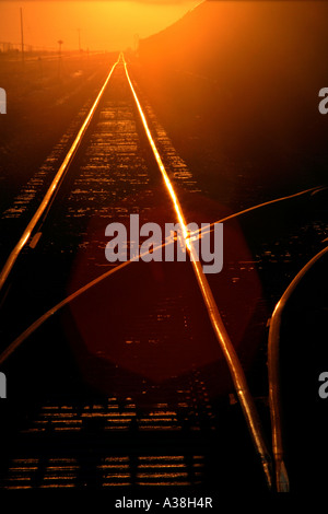 Morning sun lighting up railroad track Stock Photo - Alamy