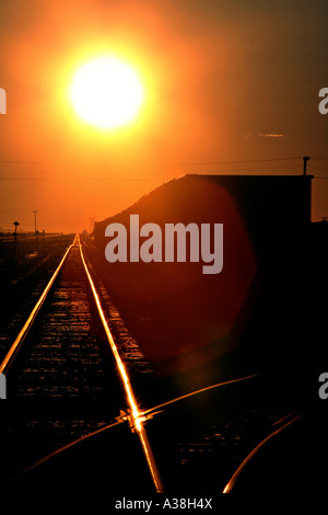 Morning sun lighting up railroad track Stock Photo - Alamy