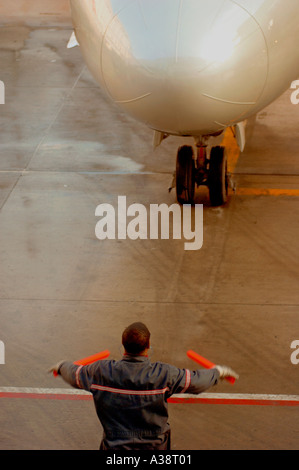 Ground crewman guiding an aircraft Stock Photo - Alamy