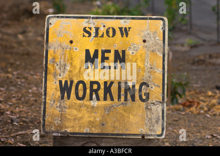 SLOW MEN WORKING SIGN Stock Photo - Alamy