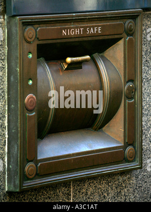 A brass curb side night safe deposit box in a bank Stock Photo - Alamy