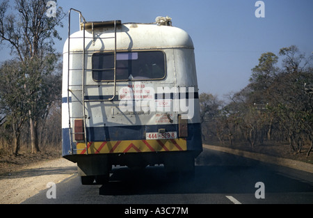A public bus exhaust black smoke on a road at YiWu Stock Photo - Alamy