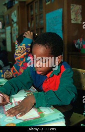 Student Desk in a classroom for learning with feathered pen and paper ...