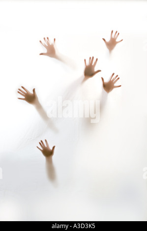 Hands trying to reach through a barrier Stock Photo - Alamy