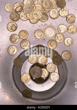 Image showing pound sterling being washed down the plughole or drain ...