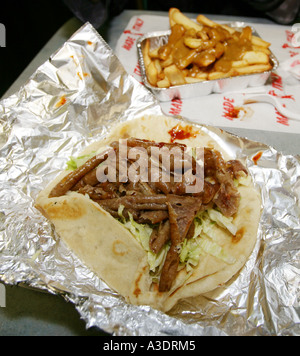 Shish kebab with beer and sauce on a wooden board top view Stock Photo ...