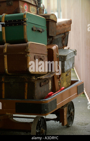 Victorian luggage stacked on a trolley at a train station, Vale Of ...