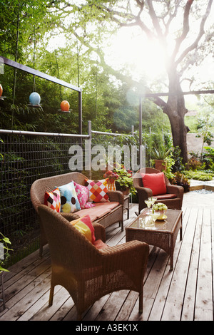 A table and chairs with a hanging light Stock Photo - Alamy
